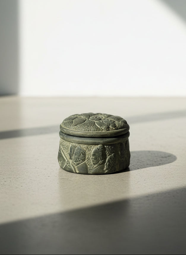 Hand-Carved Dark Grey Terracotta Lidded Vessel with Tribal Portrait Re ...